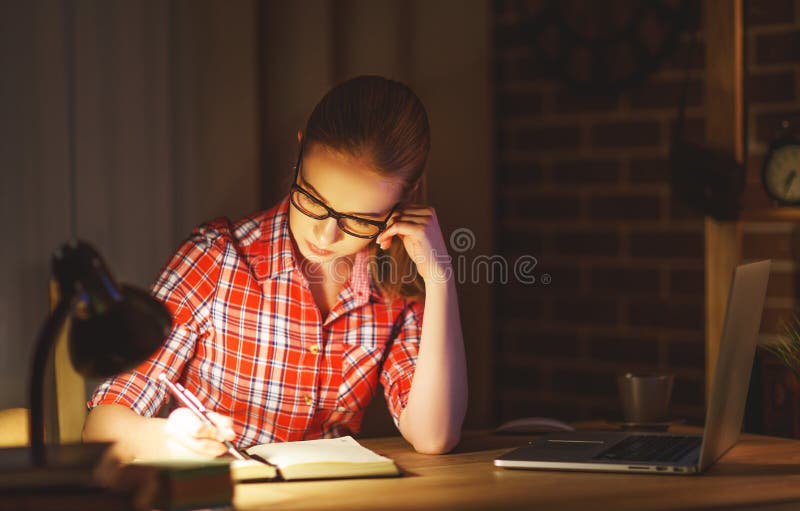 Young Woman Student Working on the Computer at Night Stock Photo ...