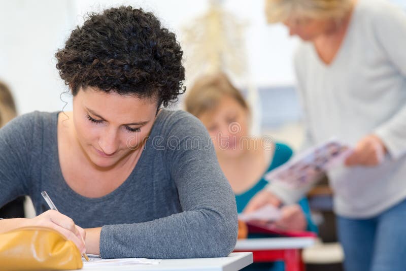 Young Woman Studying in Class Stock Photo - Image of notebook, taking ...