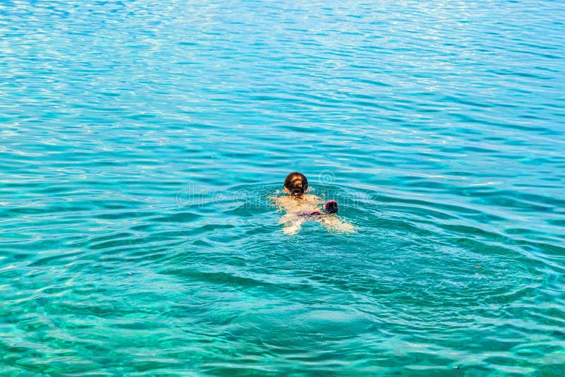 Young Woman Swimming in the Sea Stock Image - Image of beach, footwear ...