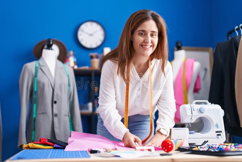 Young Woman Tailor Smiling Confident Measuring Cloth at Sewing Studio ...