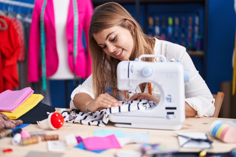 Young Woman Tailor Smiling Confident Using Sewing Machine at Sewing ...