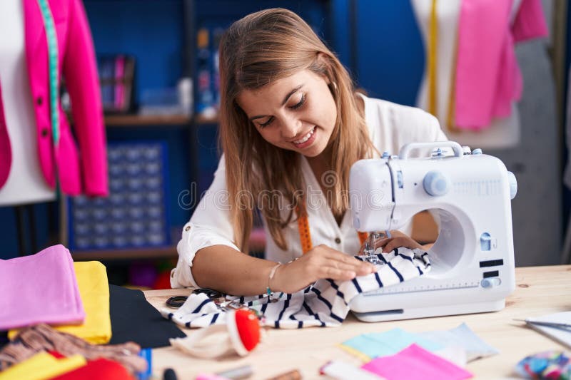 Young Woman Tailor Smiling Confident Using Sewing Machine at Sewing ...