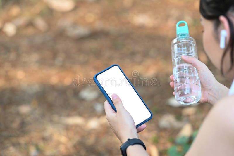 Young Woman Take a Break after Exercise Outdoors and Using Mobile Phone ...