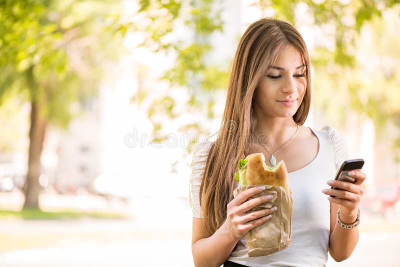 Young Woman Taking a Break for Breakfast Stock Photo - Image of holding ...