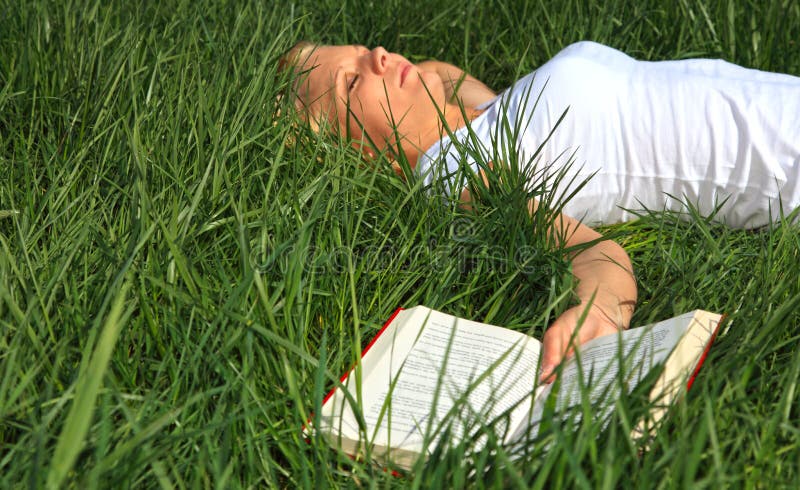 Young Woman Taking a Nap Outside Stock Image - Image of field, sleeping ...