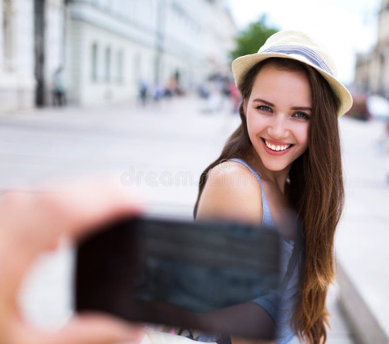 Young woman taking photo stock photo. Image of digital - 67523974