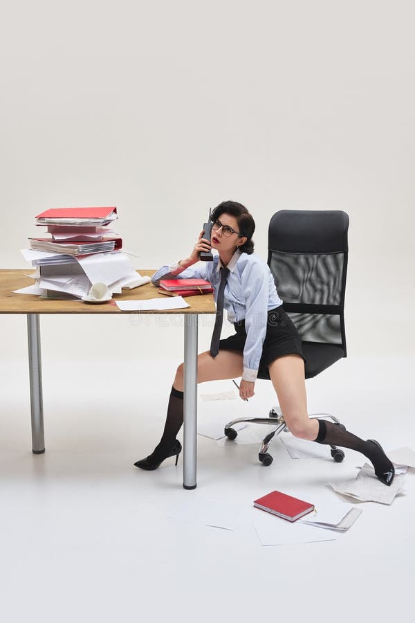 Young Woman Talking on Phone while Sitting Slouched with Open Posture ...