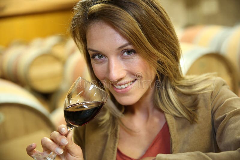 Young Woman Tasting Red Wine in Wine Cellar Stock Image - Image of ...