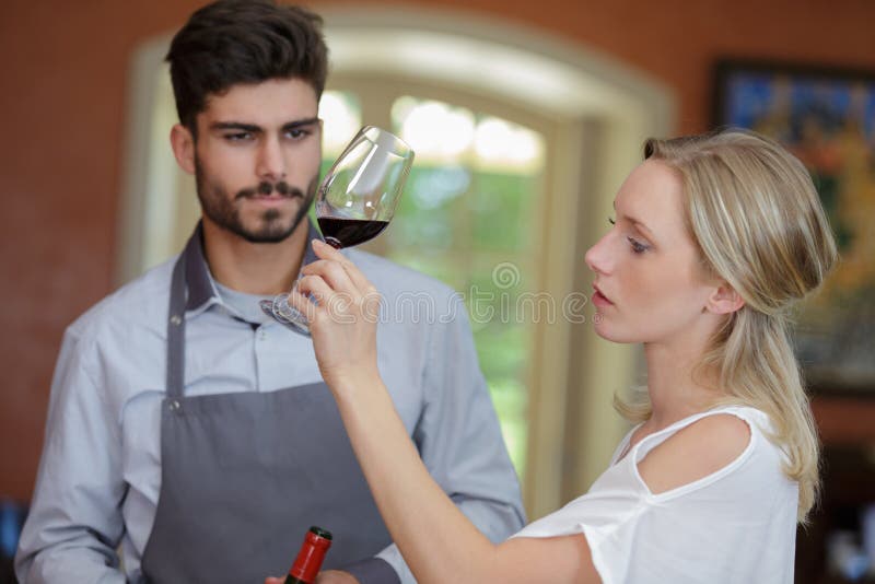 Young woman tasting wine stock photo. Image of table - 170652826