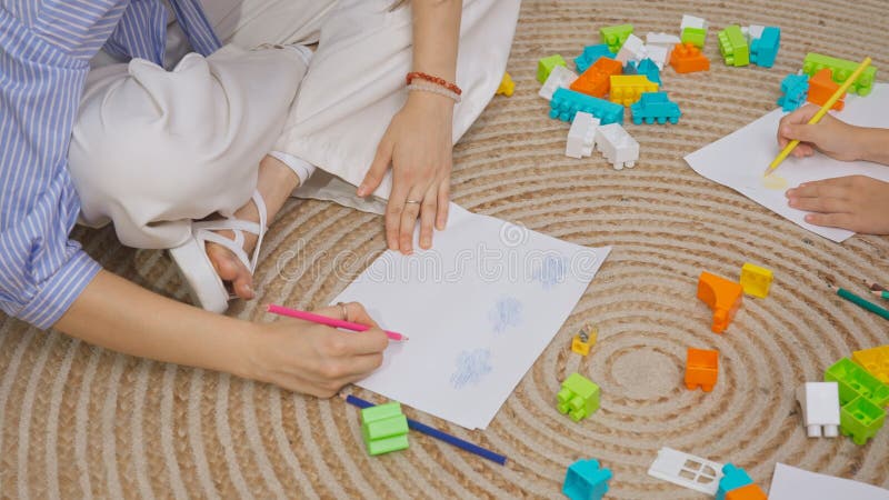 Young Woman Teacher and Group of Children Doing Creative Tasks in ...
