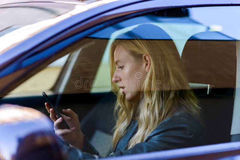 Young Woman Texting while Driving Car Stock Photo - Image of illegal ...