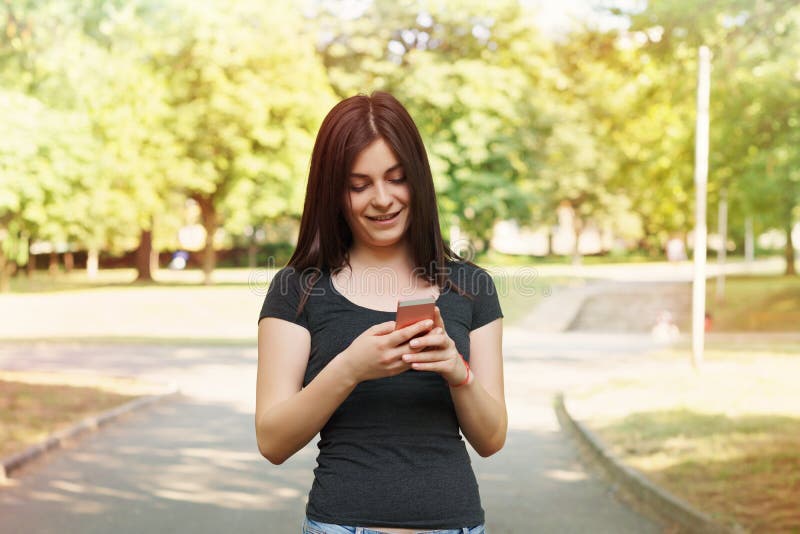 Young woman texting stock photo. Image of blond, good - 95770362