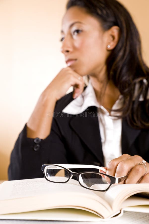 Young Woman Thinking, Focus on Eyeglasses on Book Stock Image - Image ...