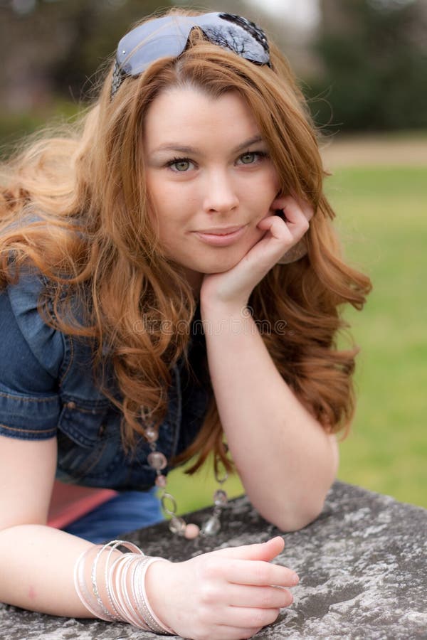 A Young Woman is Thinking in the Nature Stock Photo - Image of leaning ...