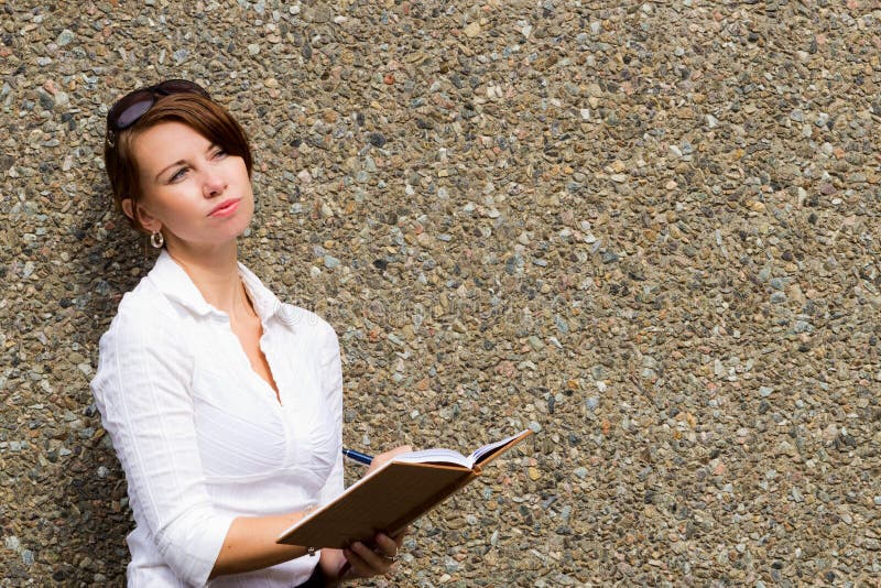 Young Woman Thinking and Writing in Her Journal Notebook Stock Photo ...