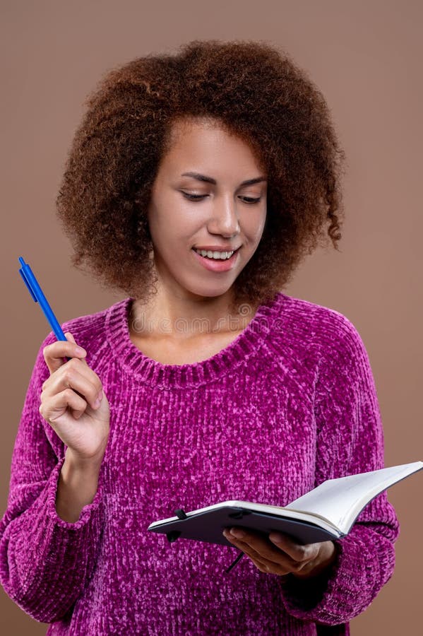 Young Woman with a Thoughtful Look Making Notes Stock Photo - Image of ...