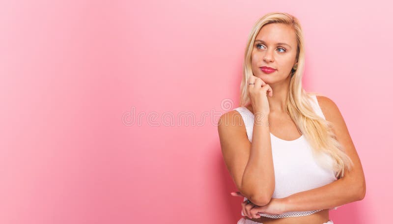 Young Woman in a Thoughtful Pose Stock Image - Image of beautiful ...