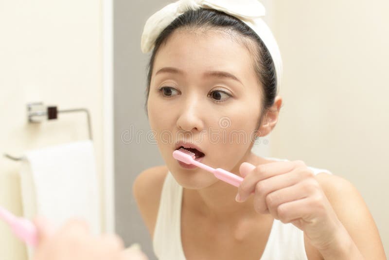 Woman brushing her teeth stock photo. Image of care - 113035698