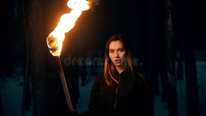 Young Lost Woman with Long Hair Standing in Forest at Night with a ...