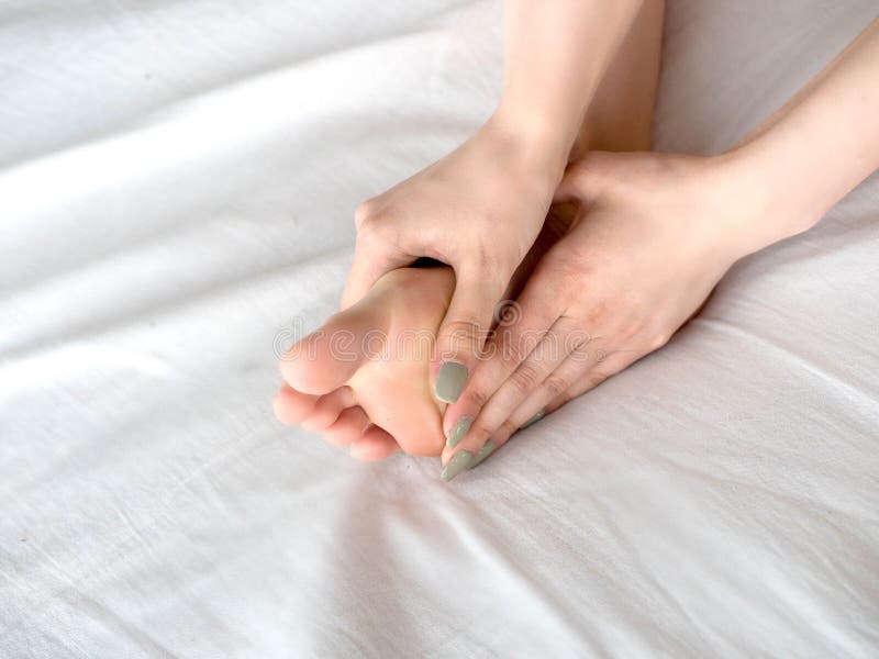 Young Woman Touching Her Leg on Bed Stock Image - Image of girl, care ...
