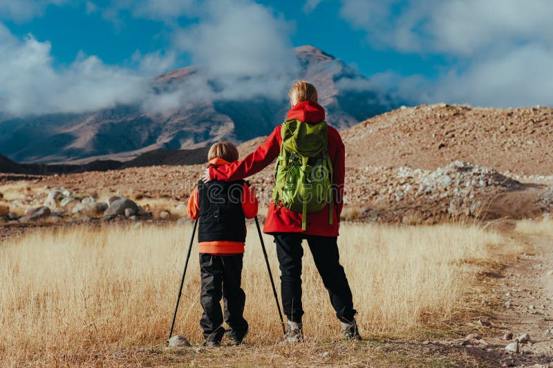 Woman Tourist with Son Looking at the Mountains, Back View Stock Image ...