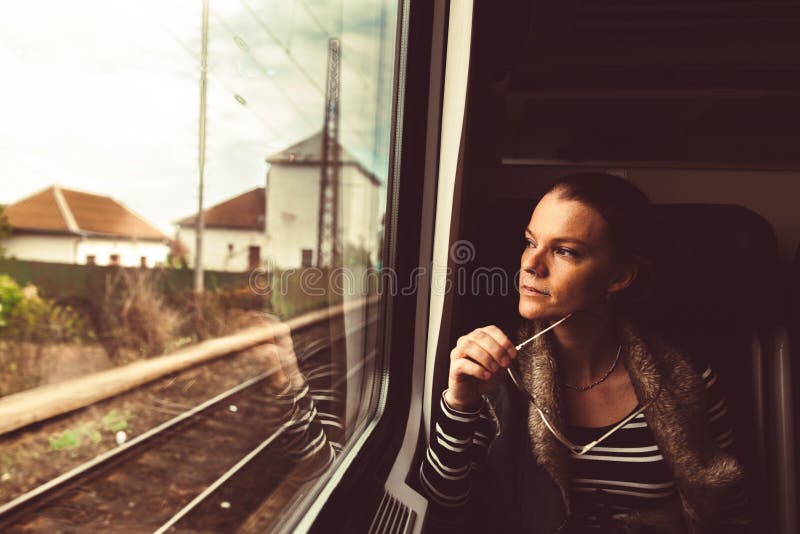 The Young Woman is on the Train and Watches through the Window O Stock ...