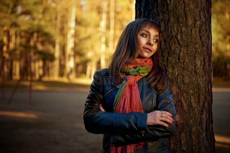 Young woman under a tree stock image. Image of cute, hair - 46997349