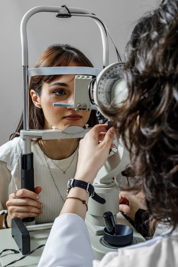 Young Woman Undergoing a Precision Eye Examination in a Clinical ...