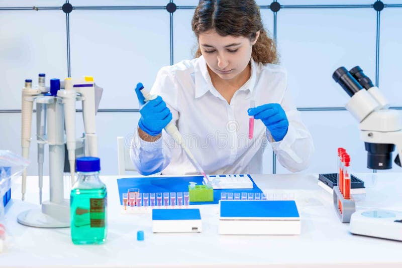 Young Woman in a University Laboratory Performing Genetic Analysis ...