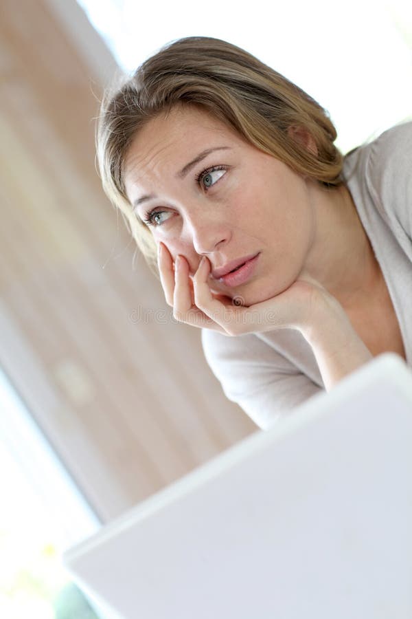Young Woman with Upset Look in Front of Laptop Stock Image - Image of ...