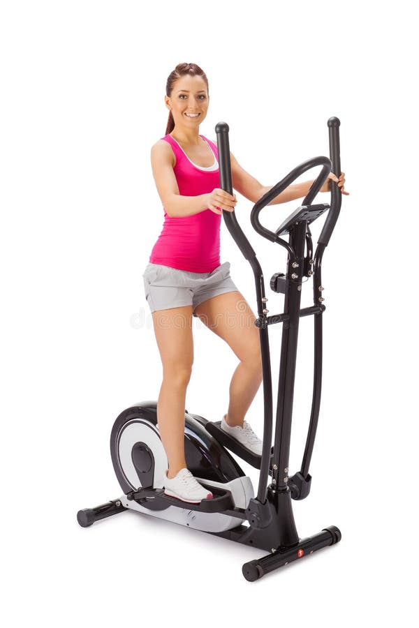 Young Woman Uses Elliptical Cross Trainer. Stock Image - Image of ...