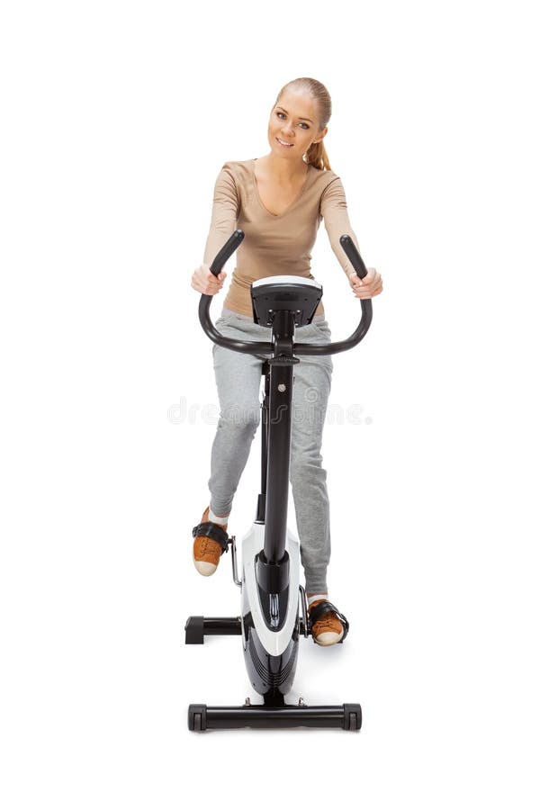 Young Woman Uses Stationary Bicycle Trainer. Stock Image - Image of ...