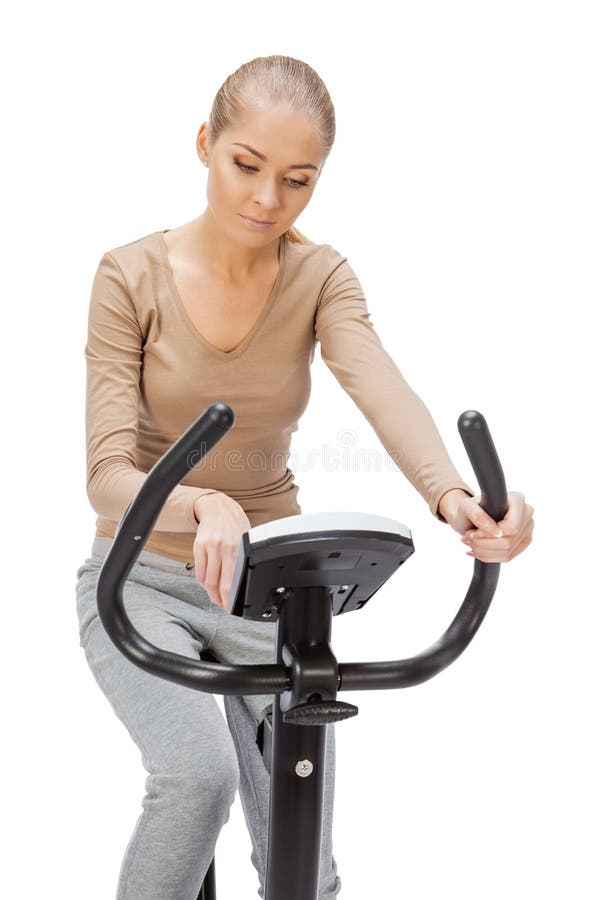 Young Woman Uses Stationary Bicycle Trainer. Stock Photo - Image of ...