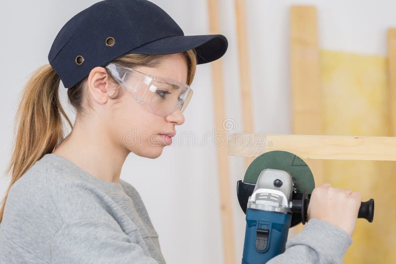 Young Woman Using Angle Grinder Stock Image - Image of manual, female ...