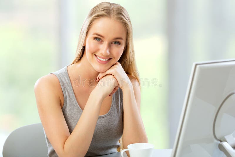 Young Woman Using Computer at Home Stock Photo - Image of long ...