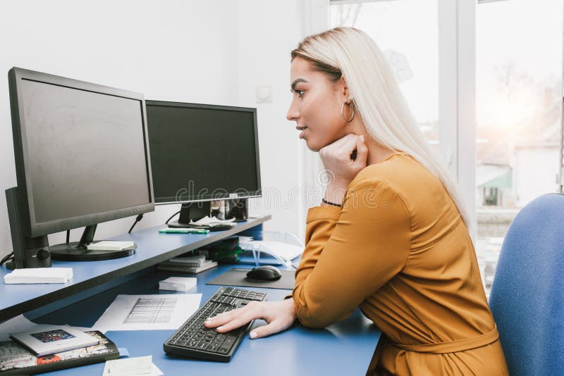 Young woman using computer stock image. Image of agency - 114736099