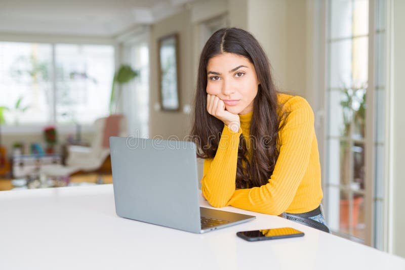Young Woman Using Computer Laptop Thinking Looking Tired and Bored with ...