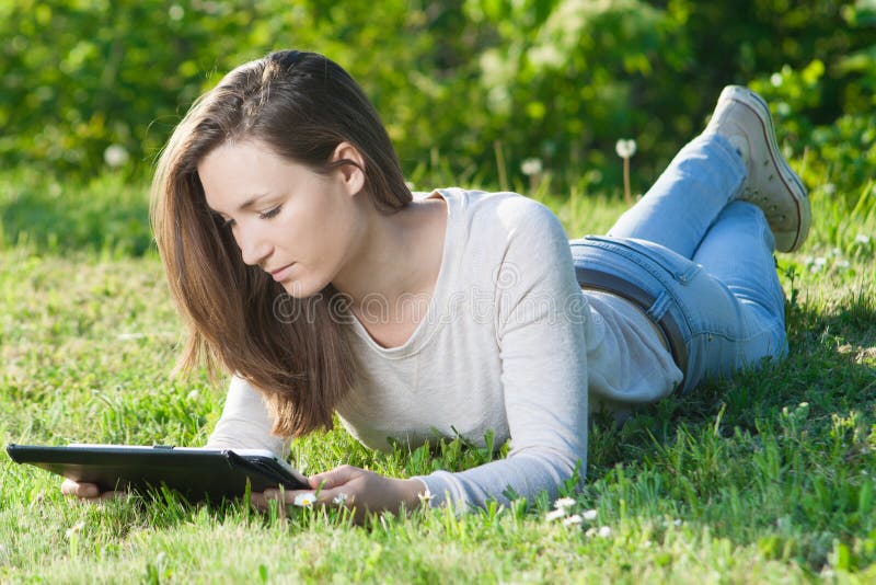 Young Woman Using Computer Tablet Pc Outdoor in the Park Stock Image ...