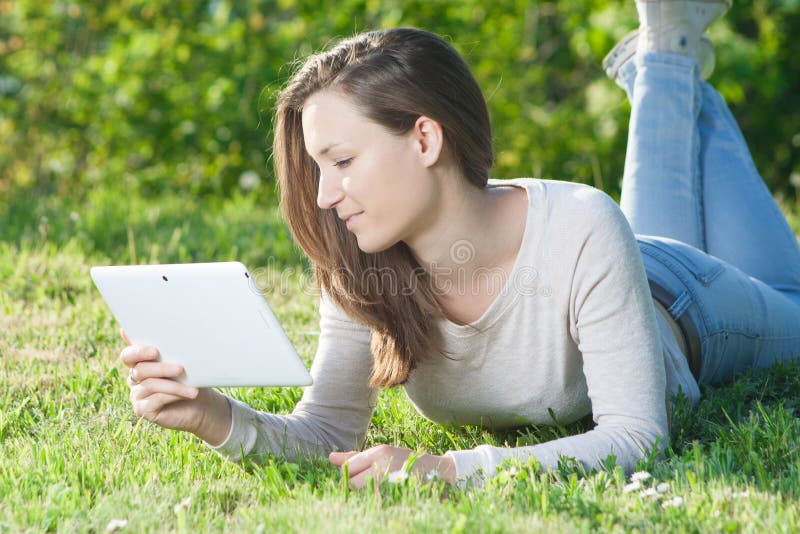 Young Woman Using Computer Tablet Pc Outdoor in the Park Stock Photo ...
