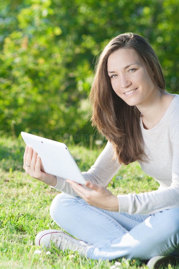 Young Woman Using Computer Tablet Pc Outdoor in the Park Stock Photo ...