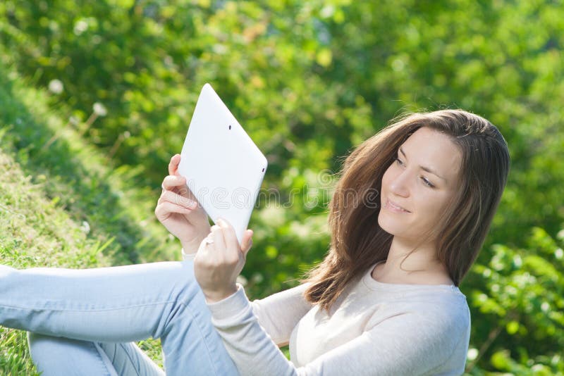 Young Woman Using Computer Tablet Pc Outdoor in the Park Stock Image ...