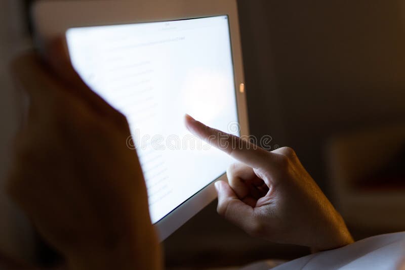 Young Woman Using Her Digital Tablet at Night. Stock Photo - Image of ...