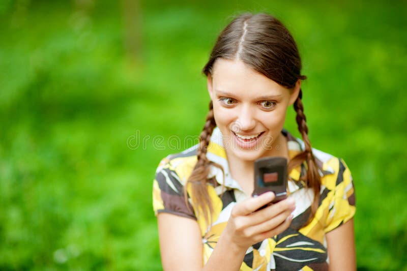 Young Woman Using Her Phone Stock Image - Image of lifestyle, laying ...