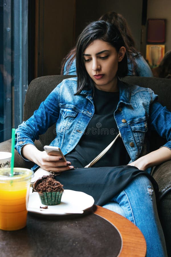 Young Woman Using Her Phone in Cafe Stock Image - Image of beautiful ...