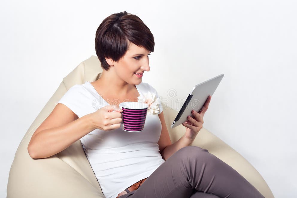 Young woman using iPad stock photo. Image of female, beauty - 21453636