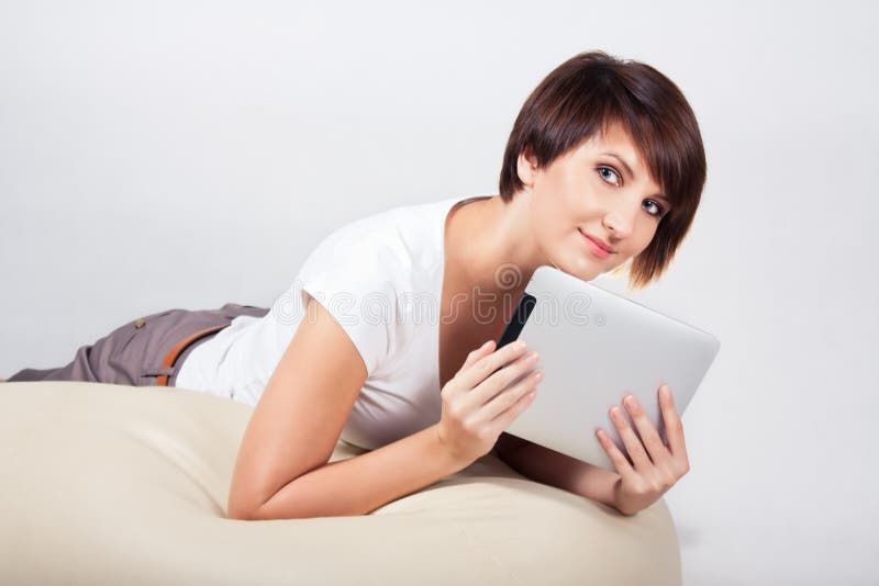 Young woman using iPad stock photo. Image of portrait - 21453754