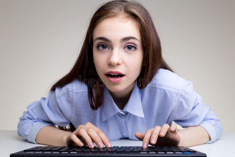 Young woman using keyboard stock image. Image of device - 72415057