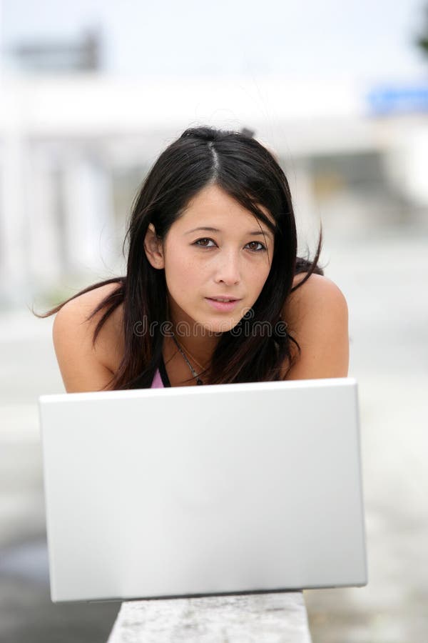 Young woman using laptop stock photo. Image of cheerful - 8786220