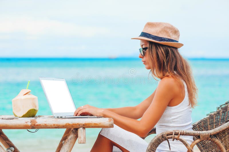Young Woman Using Laptop on the Beach. Freelance Work Stock Photo ...