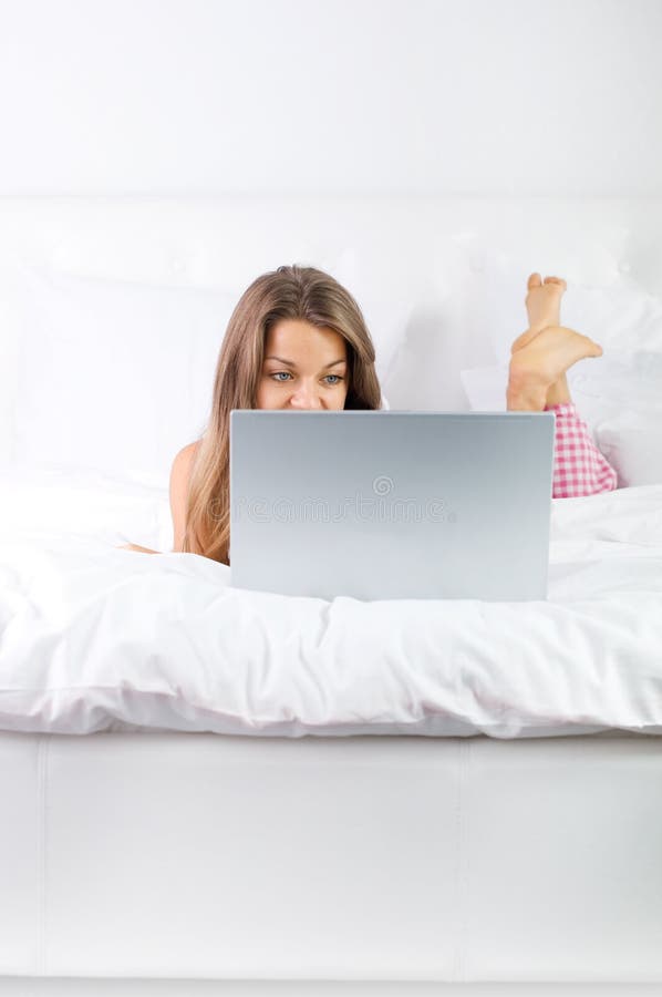 Young Woman Using Laptop in Bed Stock Photo - Image of individuality ...